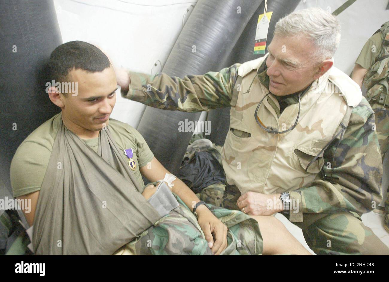 IRAQ1-C-29MAR03-MT-MAC Marine receives the Purple Heart Medal. Marine ...