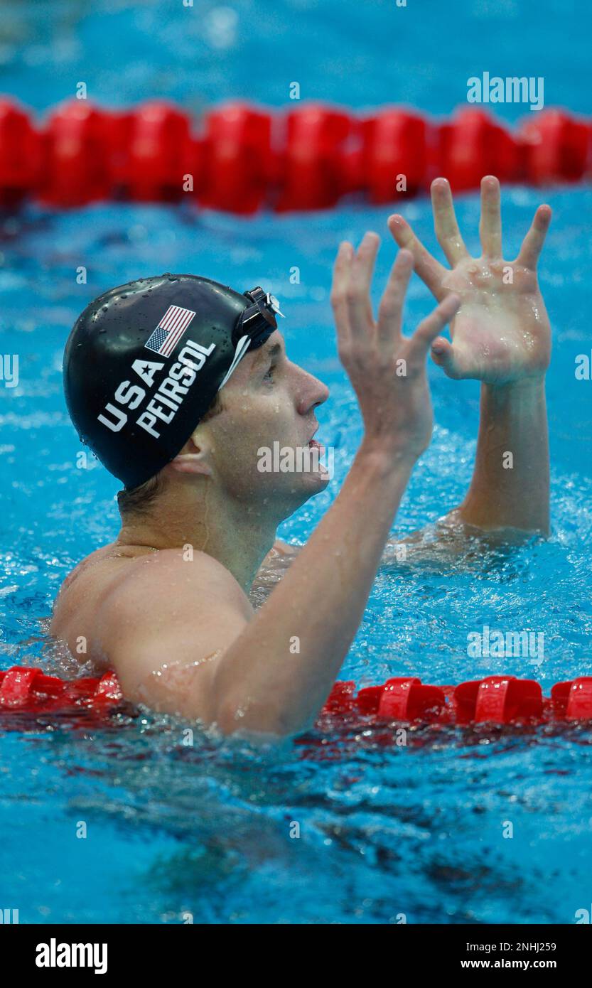 USA's Aaron Peirsol waits for the results after swimming in the 100 ...