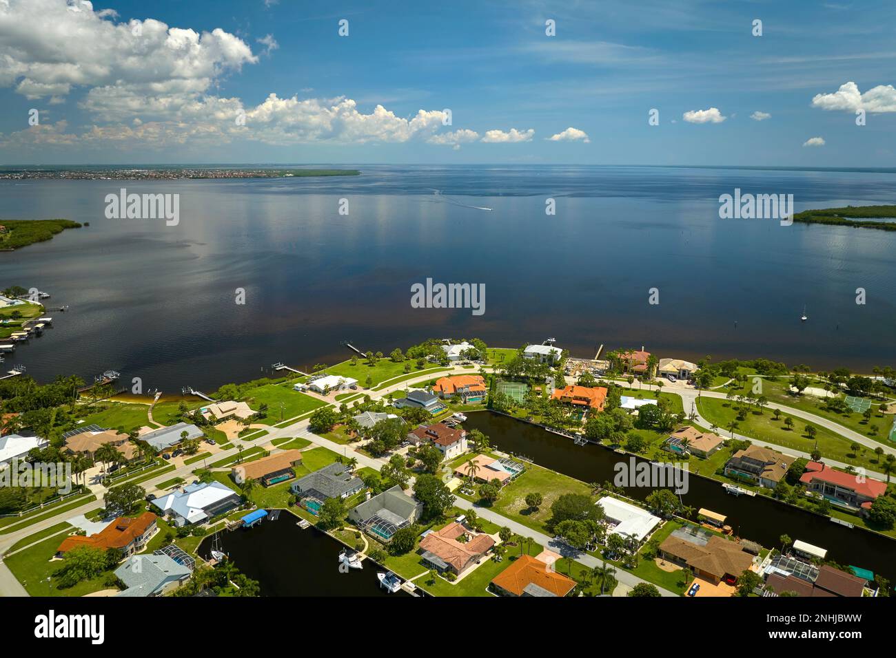 Aerial view of rural private houses in remote suburbs located on sea ...