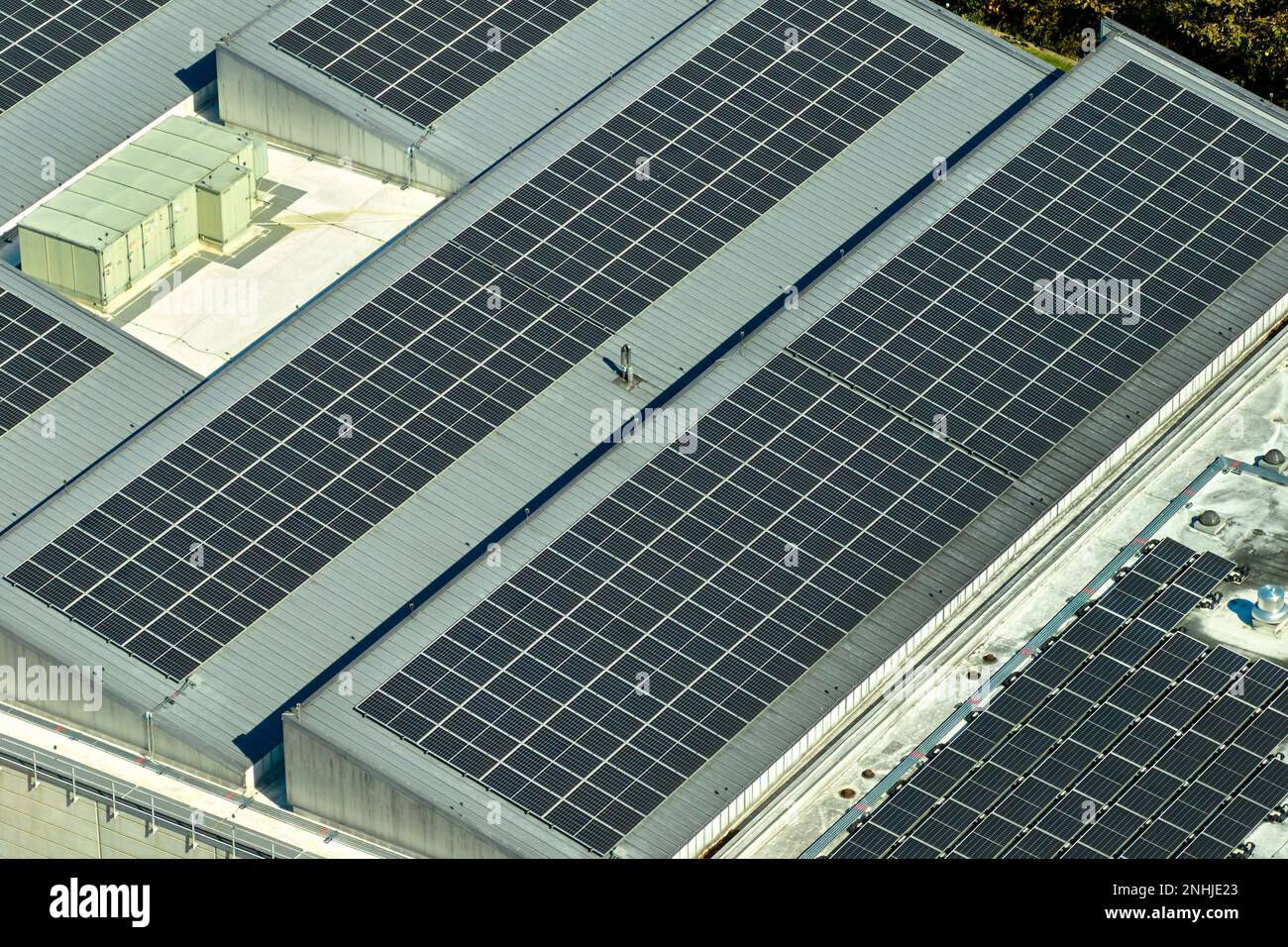 Aerial view of solar power plant with blue photovoltaic panels mounted ...