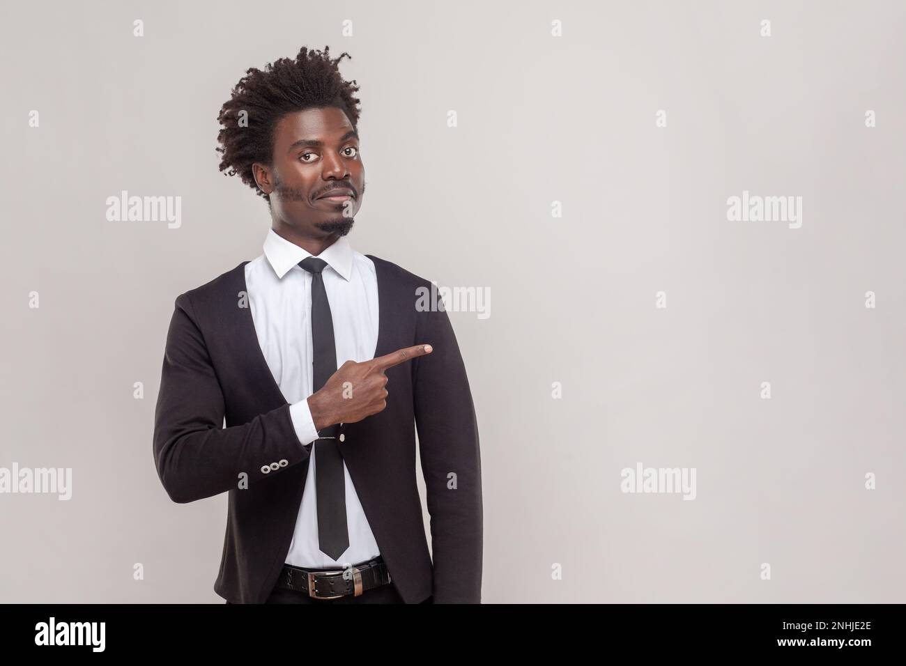 Portrait of man with petit goatee showing free space for your ...