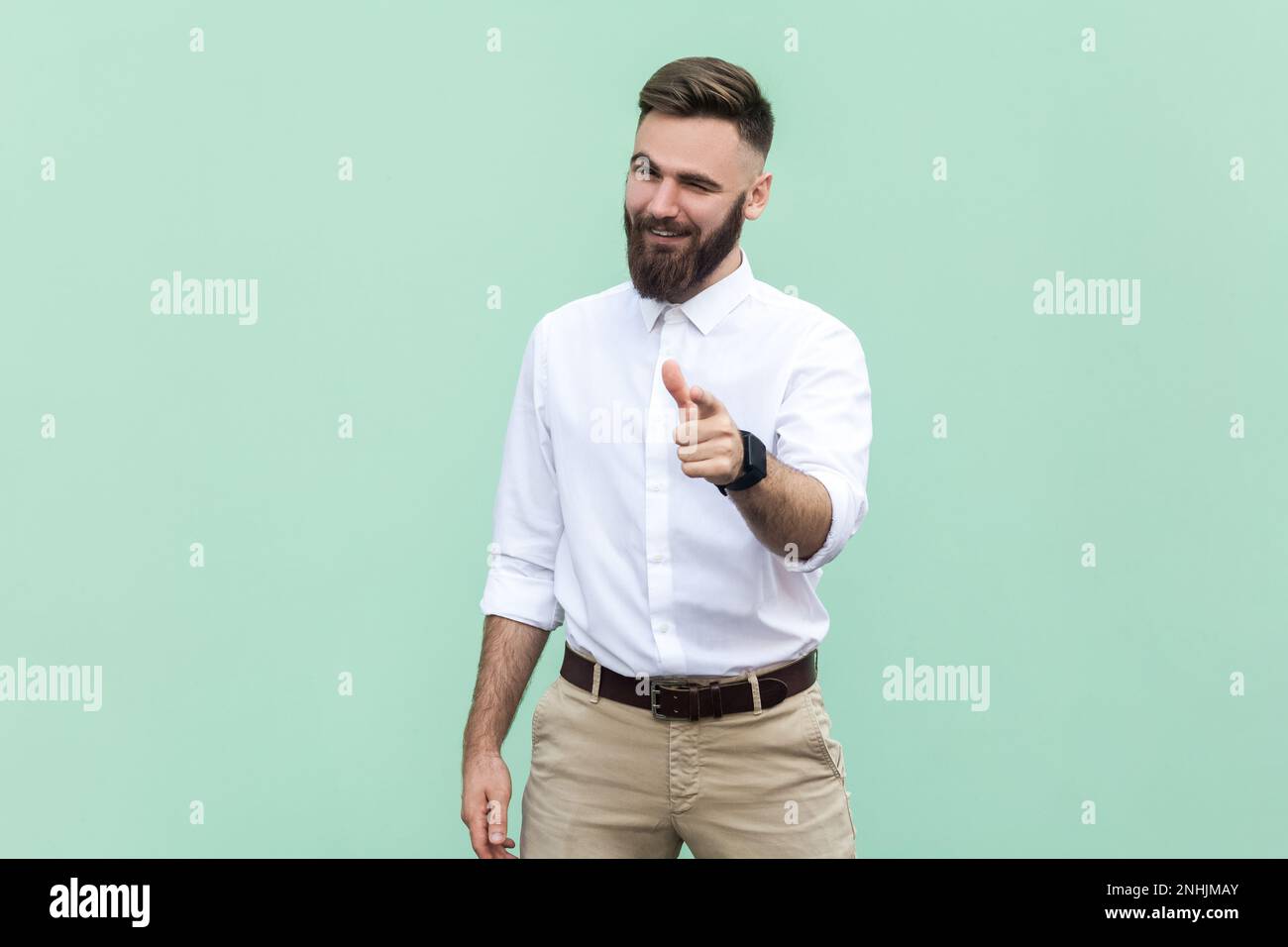Businessman pointing winking hi-res stock photography and images - Alamy