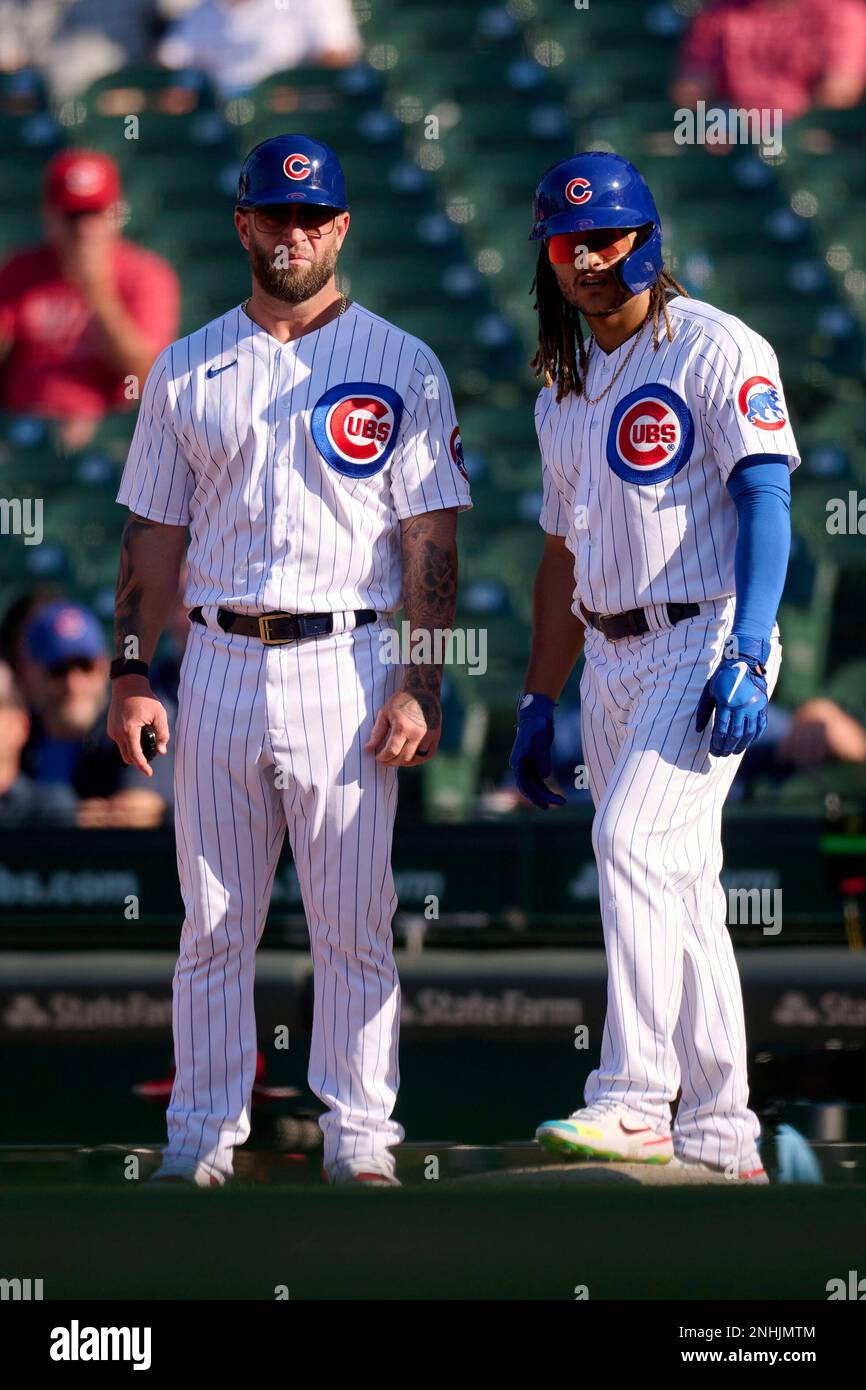 Chicago Cubs first base coach Mike Napoli (55) and pinch runner Michael ...
