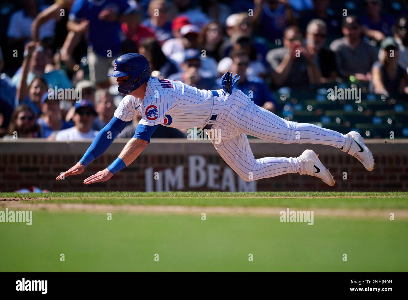 Chicago Cubs Nico Hoerner (2) slides home safely during a Major League ...