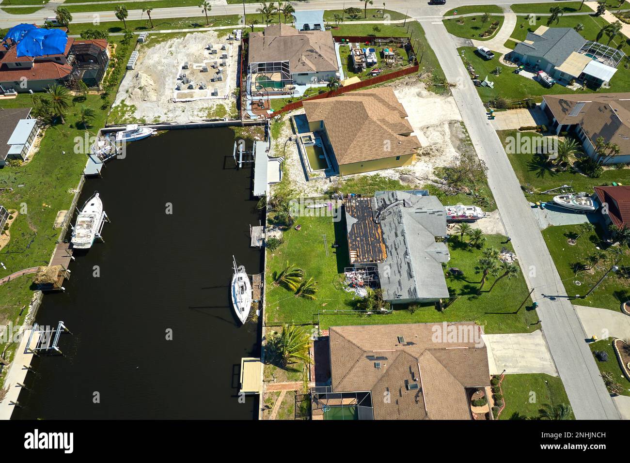 Damaged waterfront houses after hurricane Ian in Florida residential ...