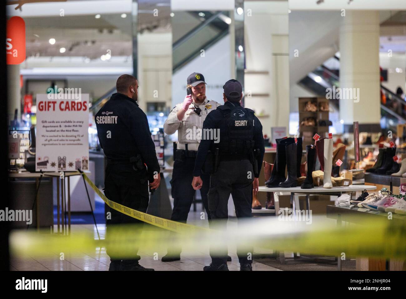 Security officers speak inside a store at the Mall of America in ...