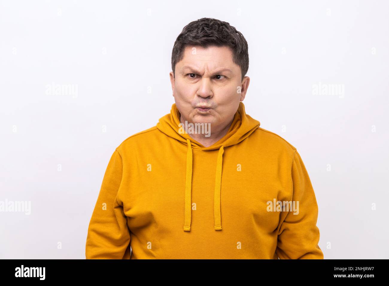 Funny amused middle aged man crossing his eyes looking crazy and stupid ...