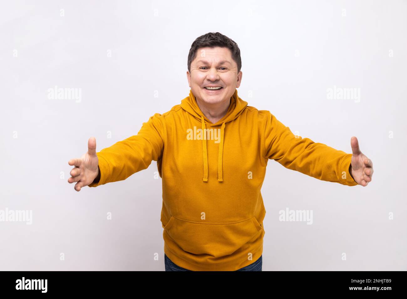 Free hugs. Portrait of friendly kind man stretching hands to camera and ...