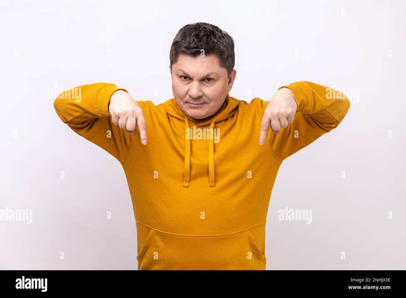 Come to me here now. Man pointing fingers down, demanding approach to ...