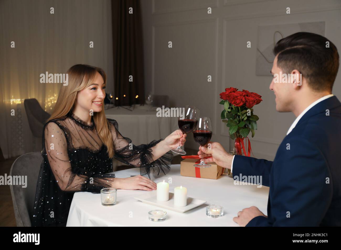 Lovely couple having romantic dinner in restaurant Stock Photo - Alamy
