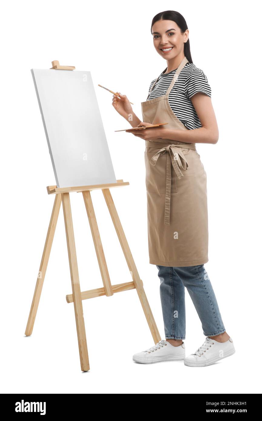 Young woman drawing on easel against white background Stock Photo - Alamy