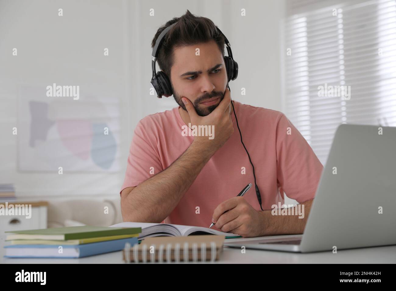 Confused man in room hi-res stock photography and images - Alamy