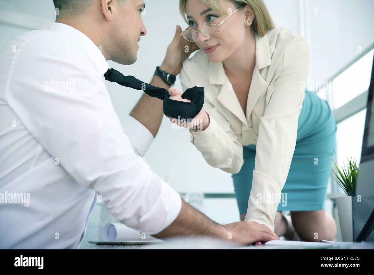 Colleagues flirting with each other during work in office. Cheating ...