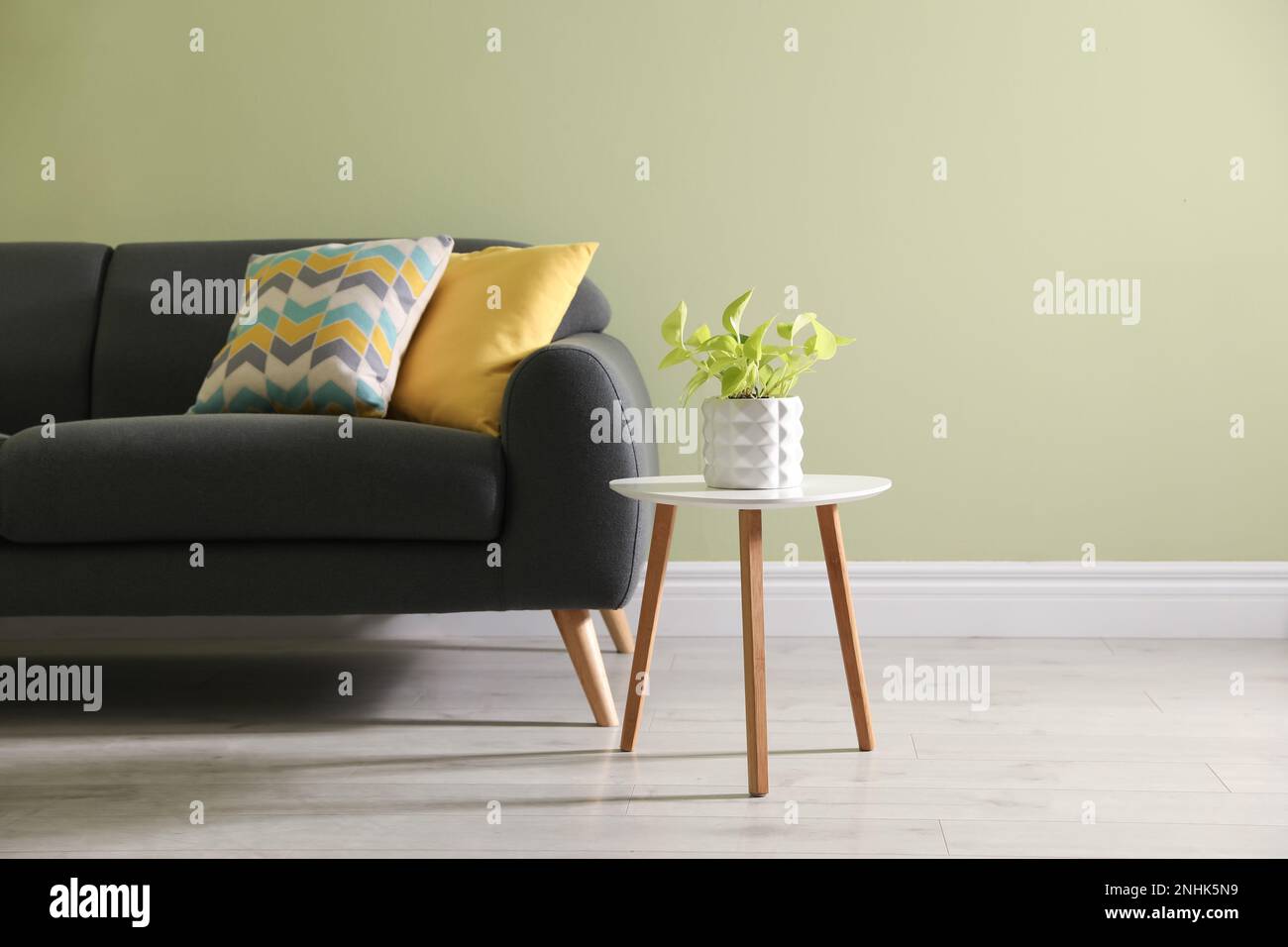 Stylish comfortable sofa in room, space for text. Interior design Stock ...