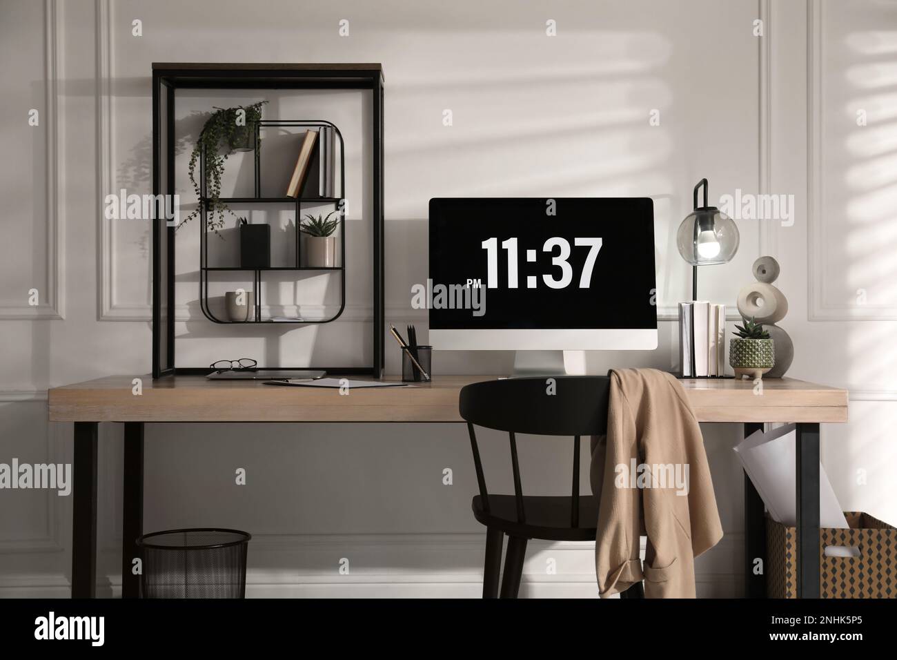 Modern computer and laptop on wooden desk in room. Interior design ...