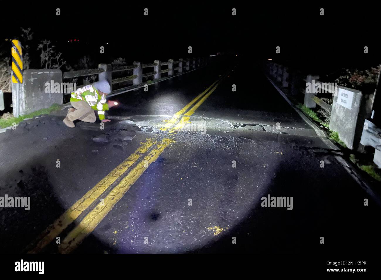 In this photo provided by Caltrans, one of their workers inspects ...