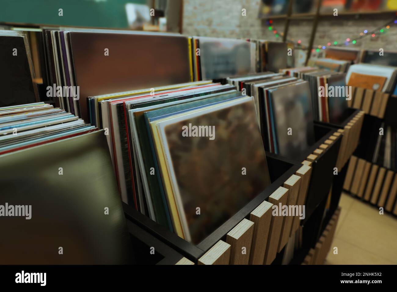 Rack with different vinyl records in store Stock Photo - Alamy