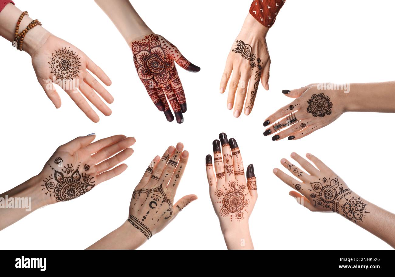 Closeup view of women with henna tattoo on hands against white ...