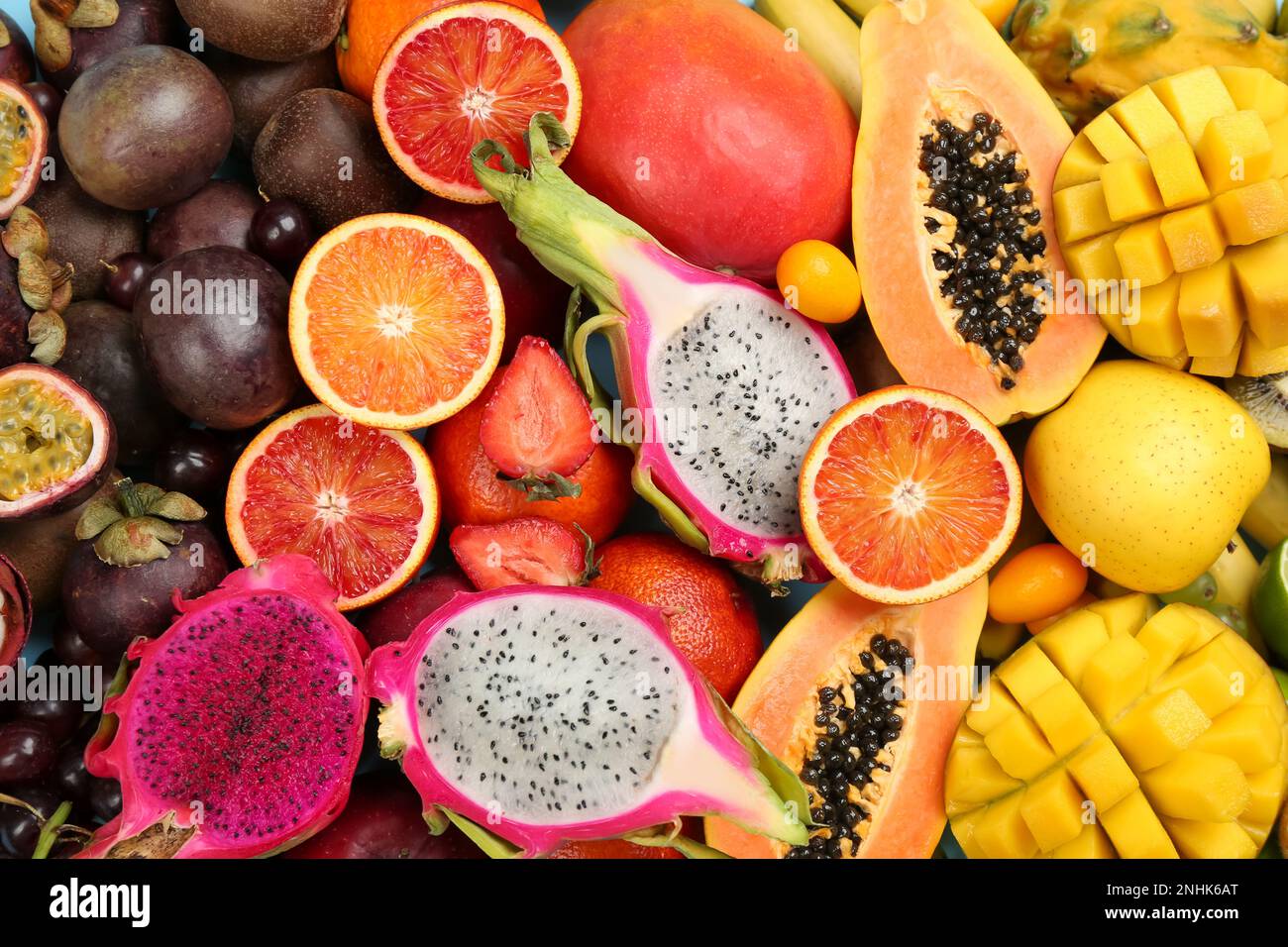 Many different delicious exotic fruits as background, top view Stock ...
