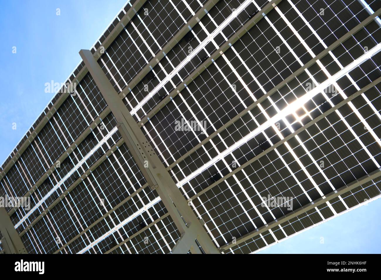 Solar panels installed as shade roof over parking lot for parked ...