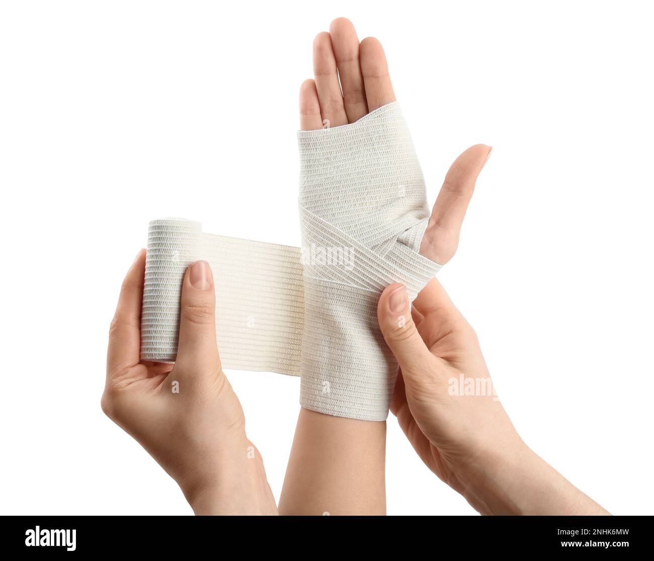 Woman applying bandage onto patient's hand on white background, closeup ...
