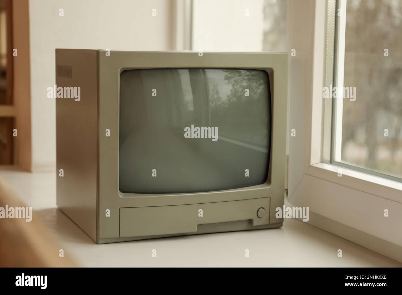 Old tv set on white windowsill indoors Stock Photo - Alamy