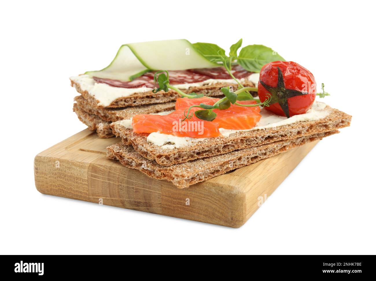 Fresh rye crispbreads with different toppings on white background Stock ...