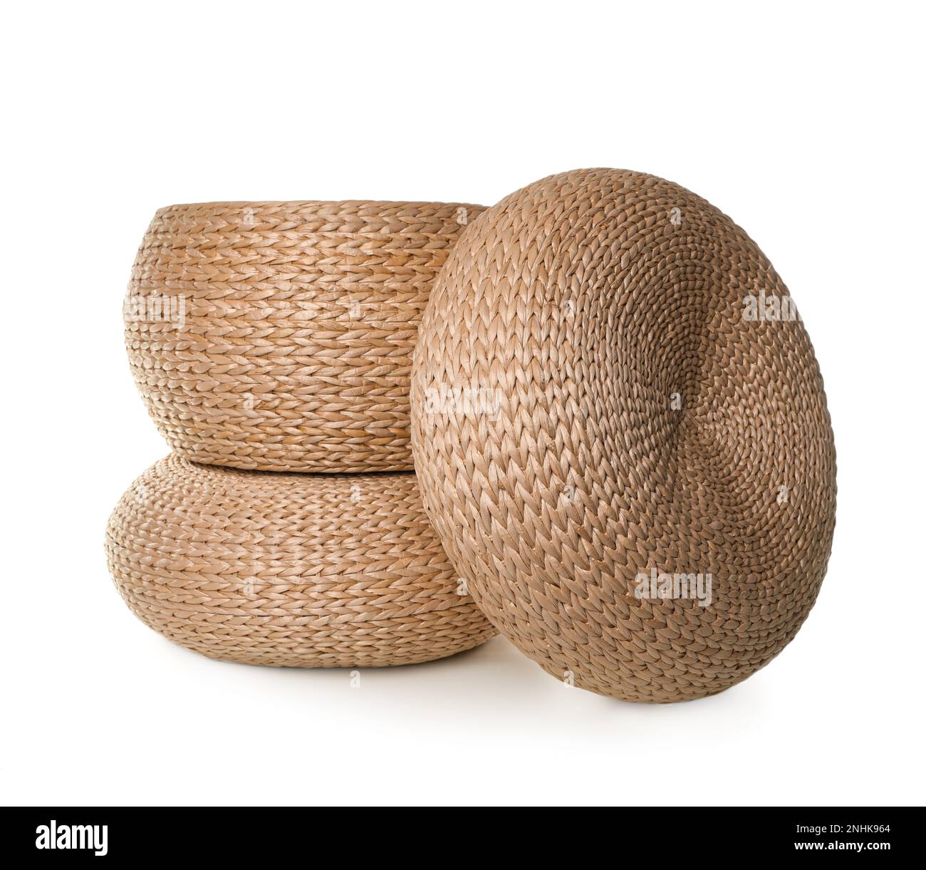 Three stylish wicker poufs on white background Stock Photo - Alamy