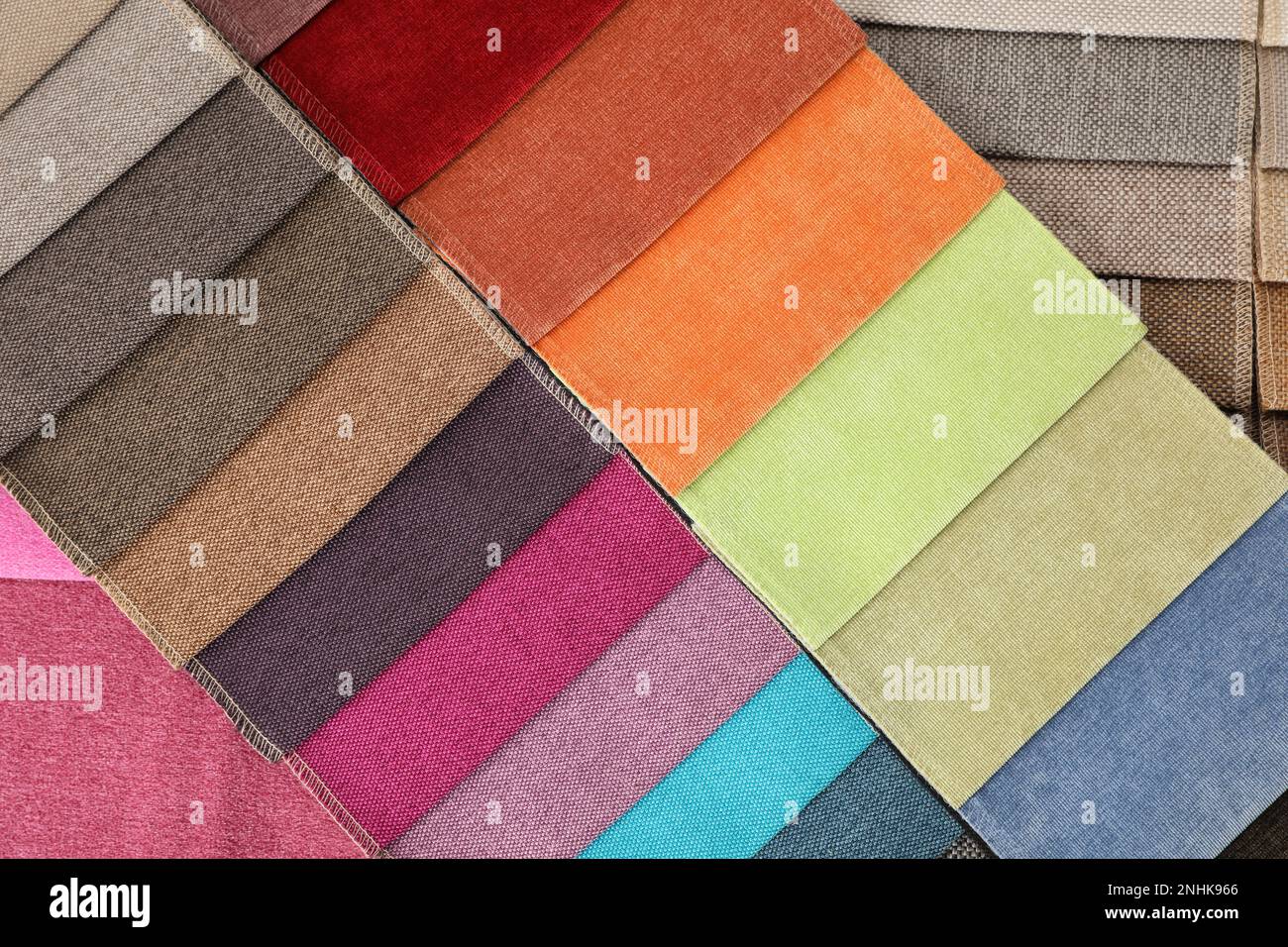 Fabric samples of different colors as background, top view Stock Photo ...