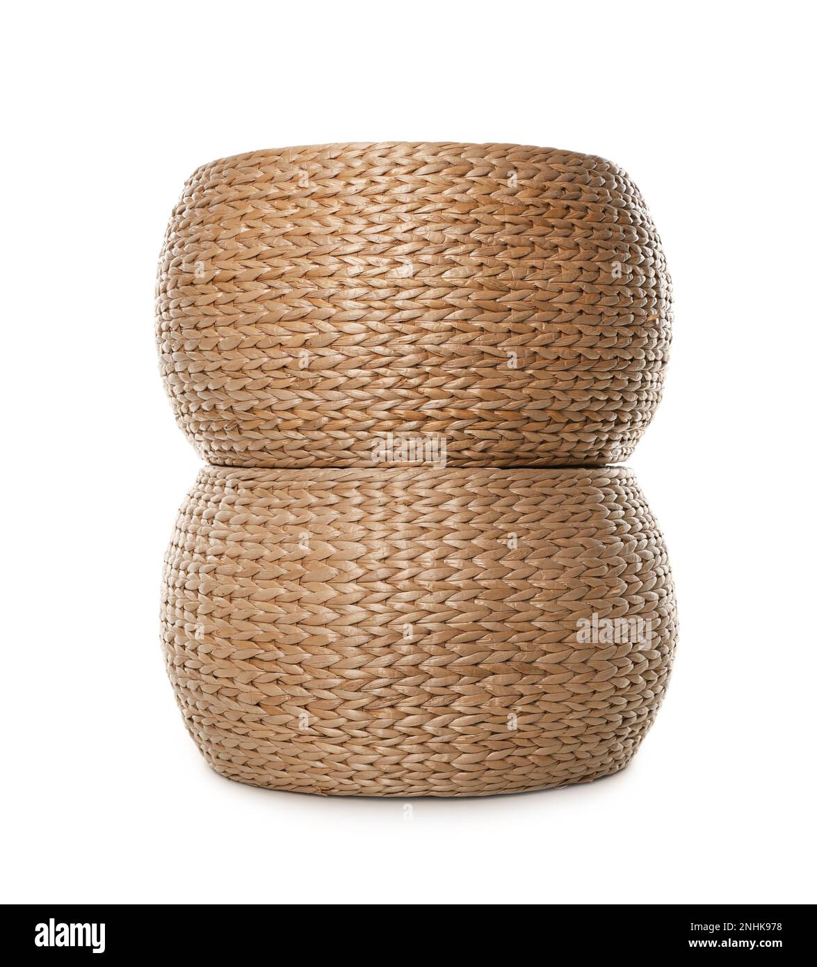 Two stylish wicker poufs on white background Stock Photo - Alamy