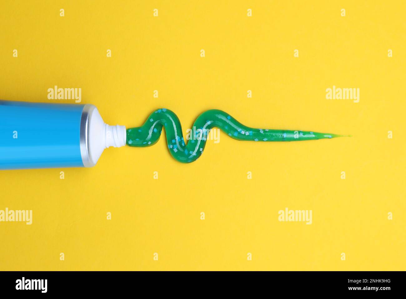 Tube of toothpaste on yellow background, flat lay Stock Photo - Alamy