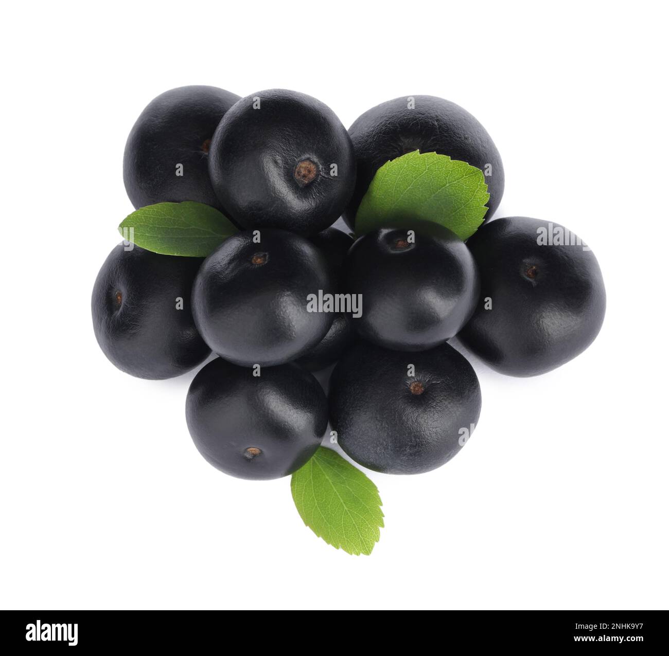 Pile of fresh ripe acai berries and green leaves on white background ...