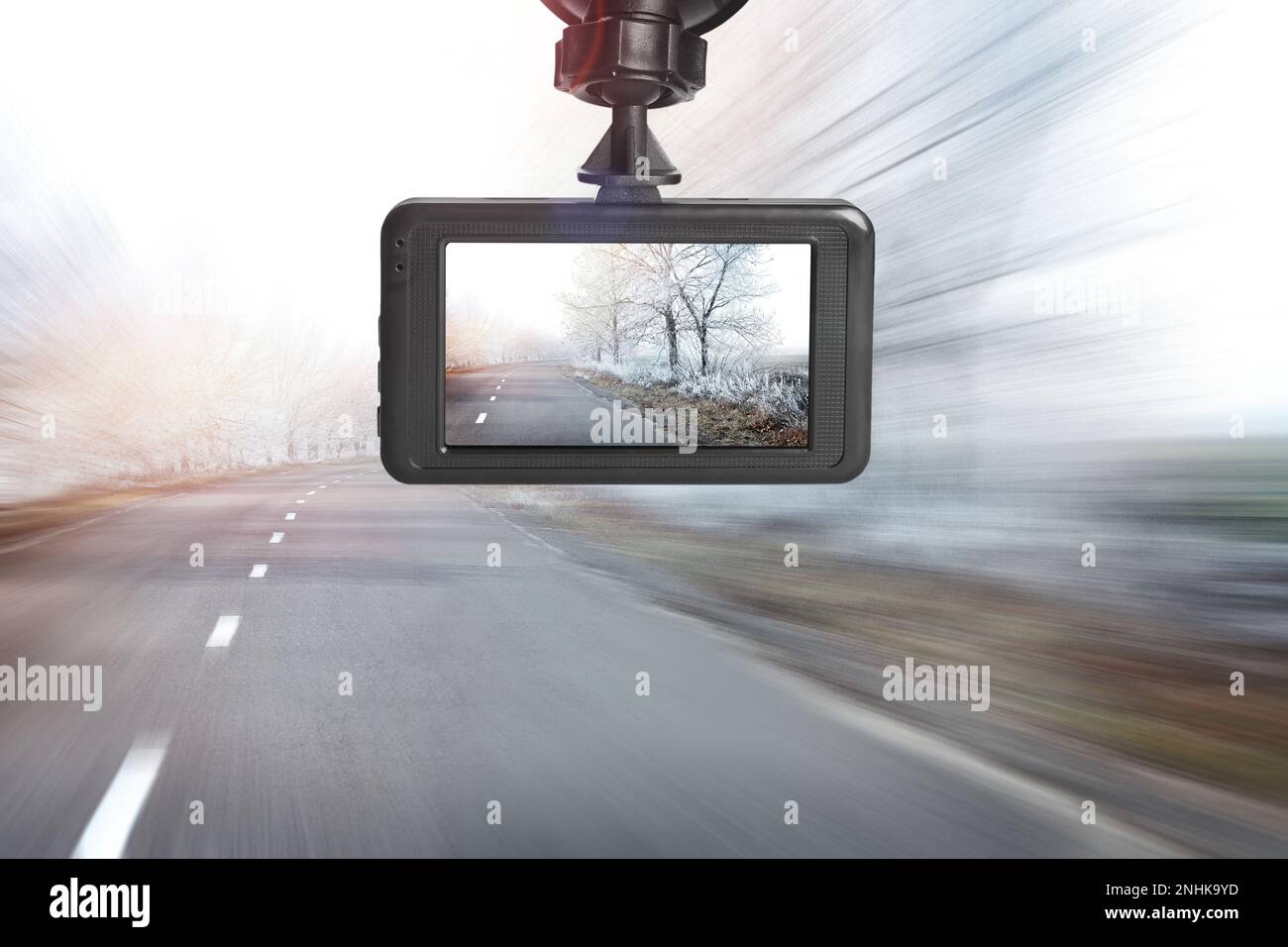 Modern dashboard camera mounted in car, view of road during driving ...