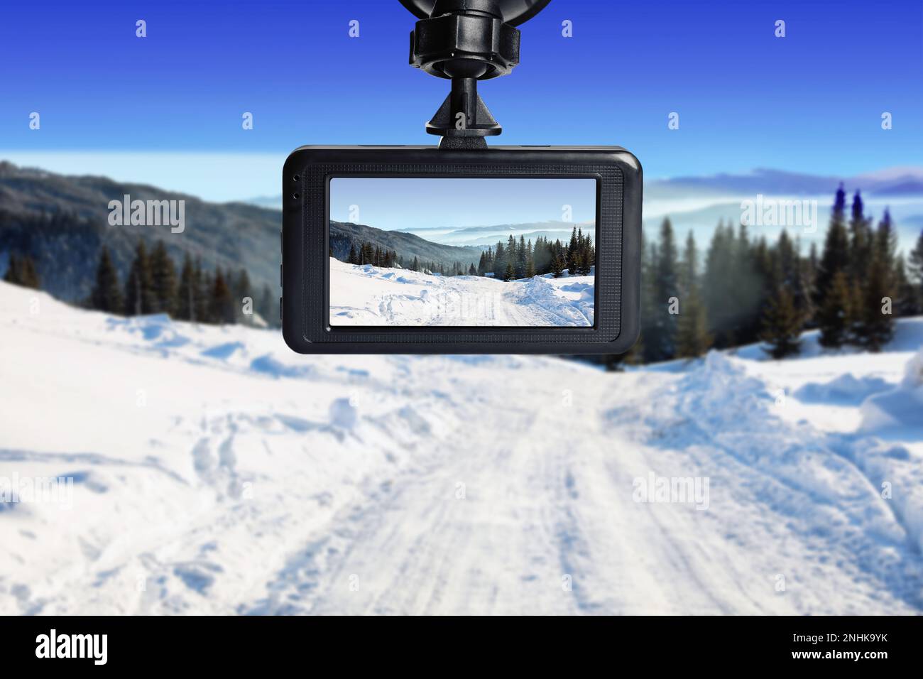 Modern dashboard camera mounted in car, view of road during driving ...