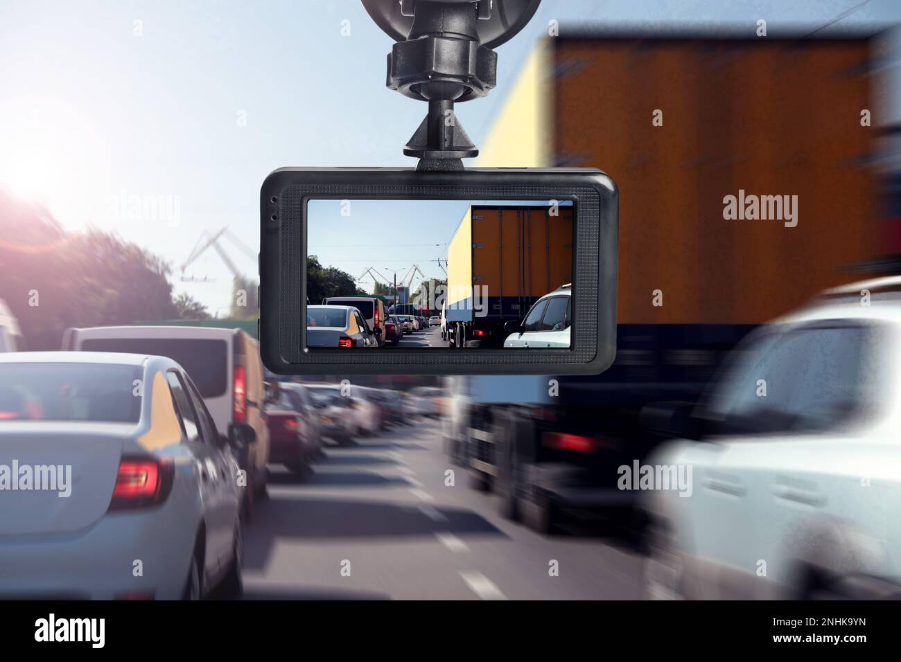 Modern dashboard camera mounted in car, view of road during driving ...