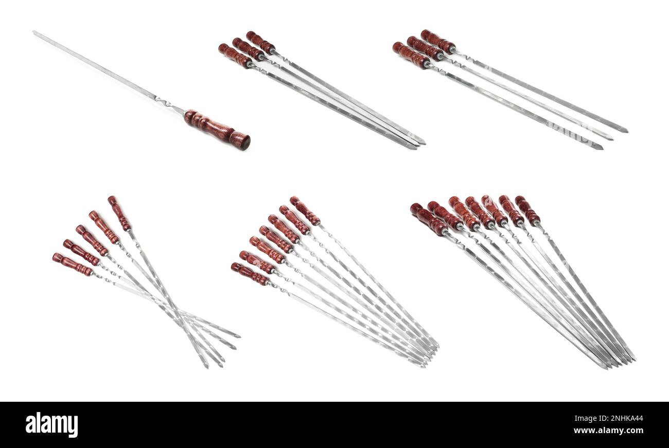 Set with metal skewers on white background Stock Photo - Alamy