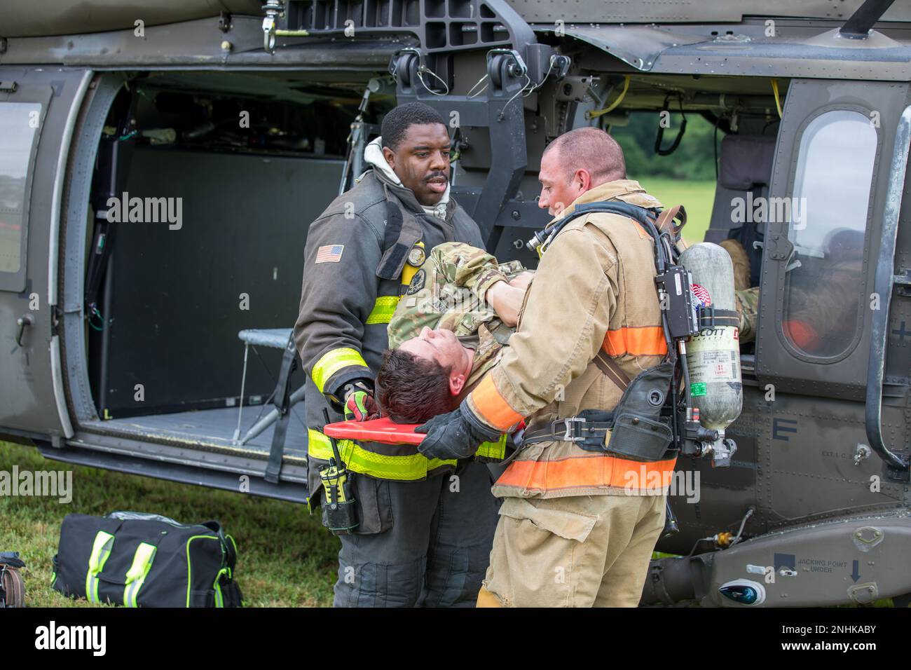 Aberdeen Proving Grounds firefighters remove a pilot from a UH-60 ...