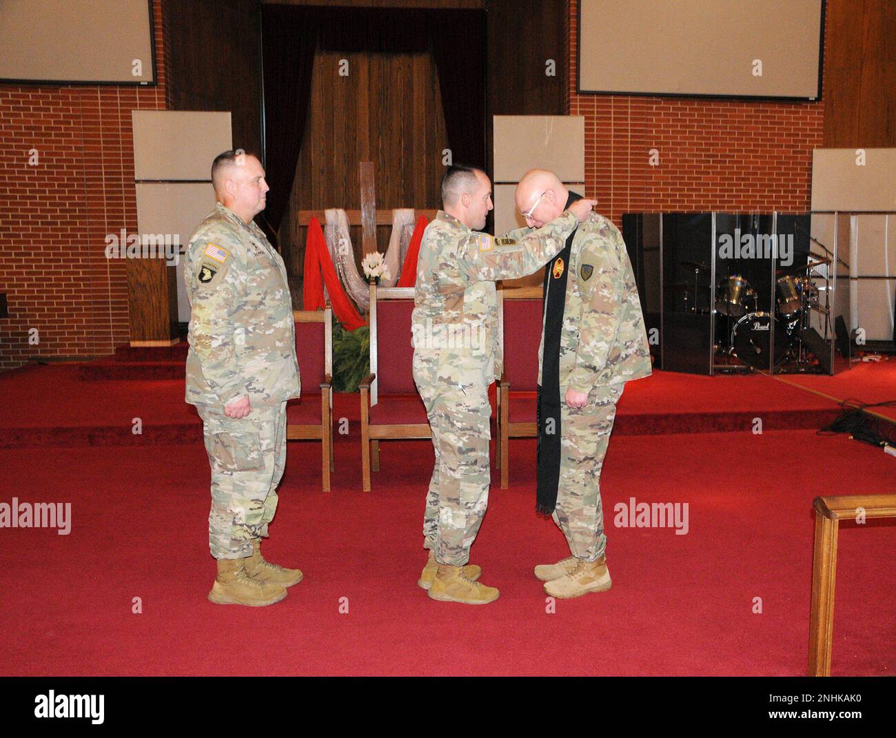 Col. Sam Smith, Fort Polk garrison commander, (center) passes the stole ...