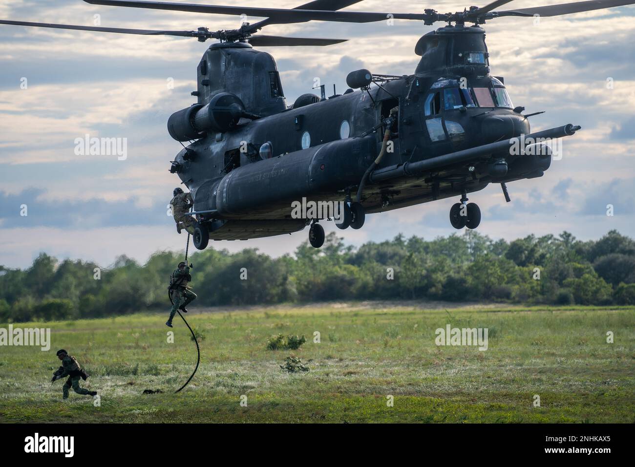7th Special Forces Group (A) Soldiers carry out a fast rope insertion ...