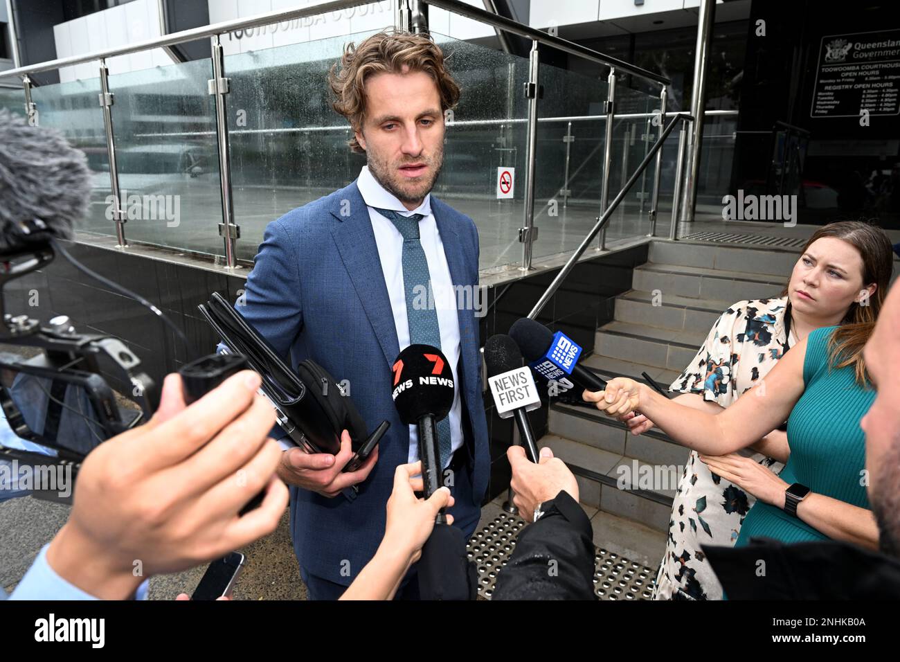 Media Lawyer Xander Croft (centre) is seen outside Toowoomba ...