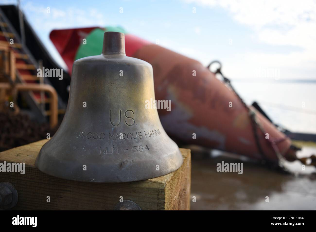 The bell from the Coast Guard Cutter Marcus Hanna sits on top of a ...