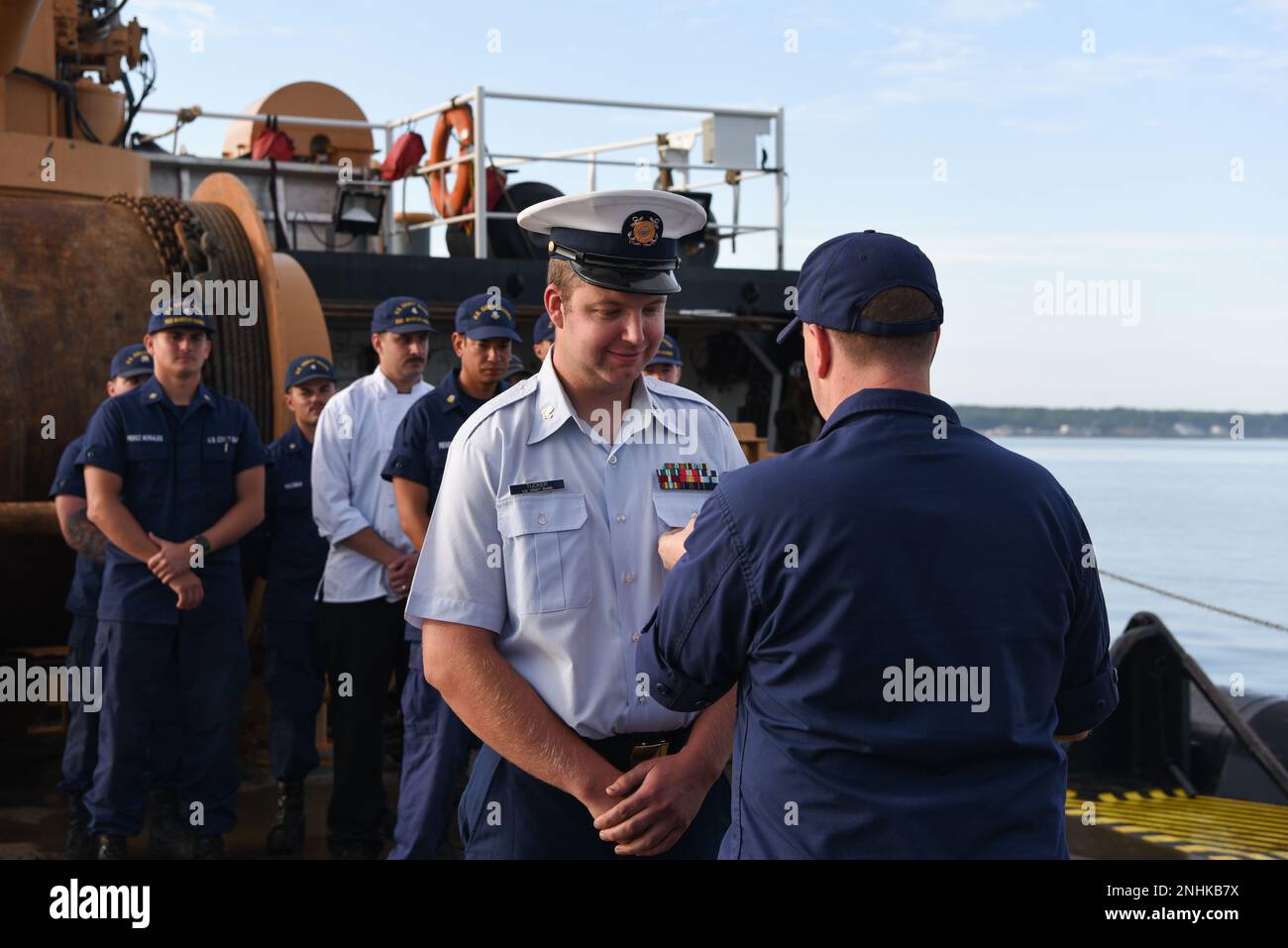 Senior Chief Joshua Jenness pins a permanent cutterman insignia on ...