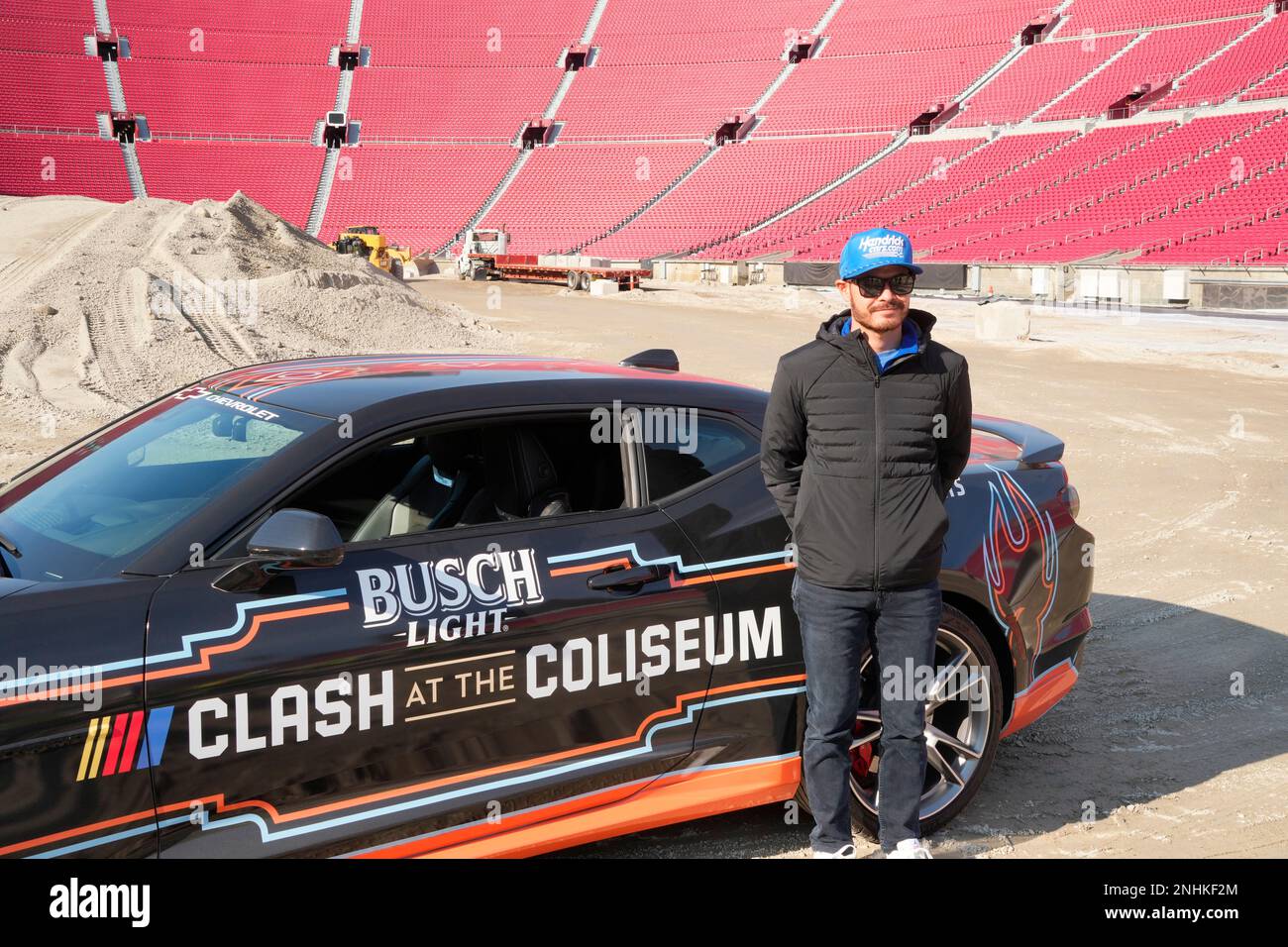 Kyle Larson poses with Chevrolet pace car during 2023 Busch Light Clash ...