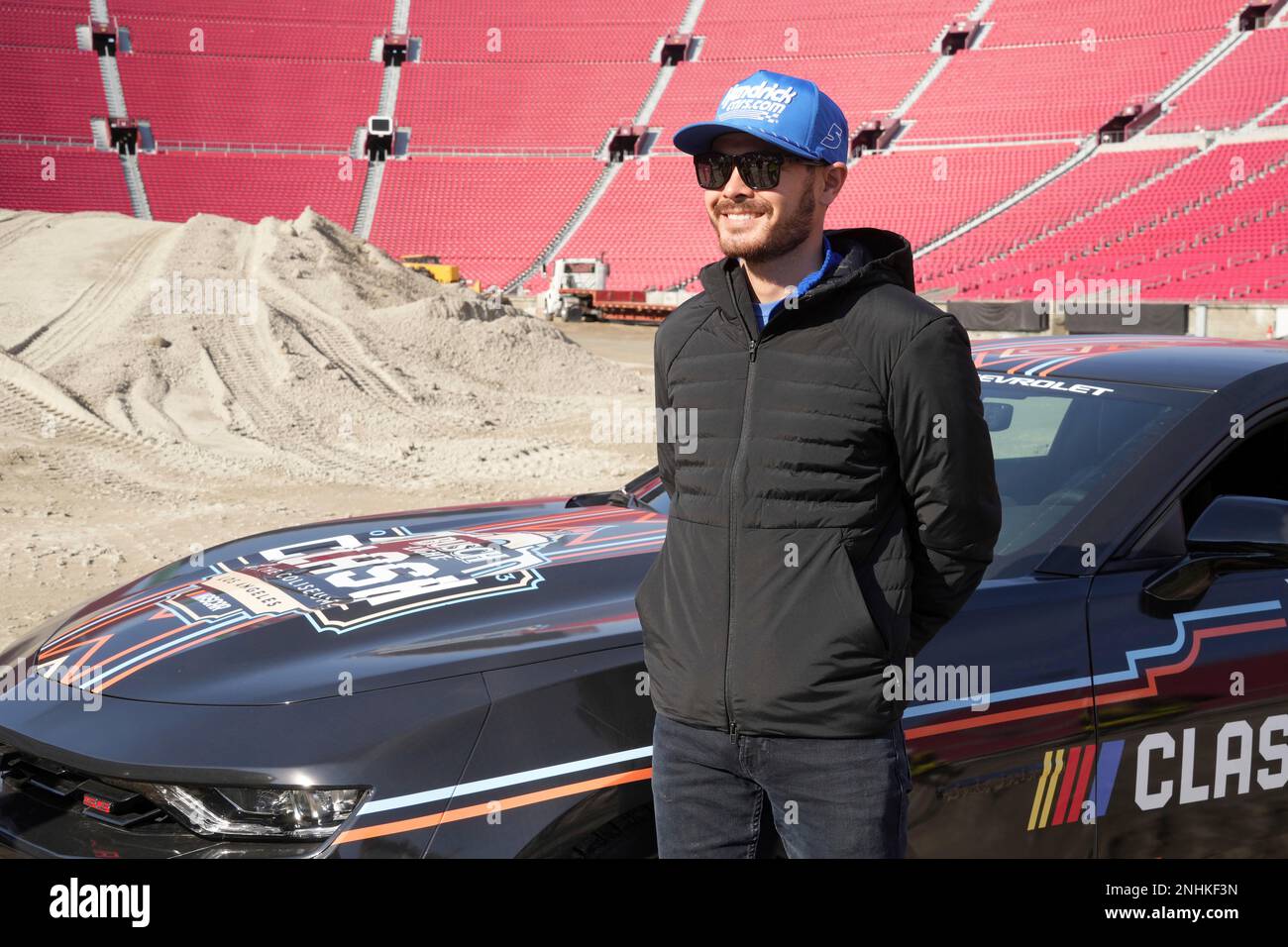 Kyle Larson poses with Chevrolet pace car during 2023 Busch Light Clash ...