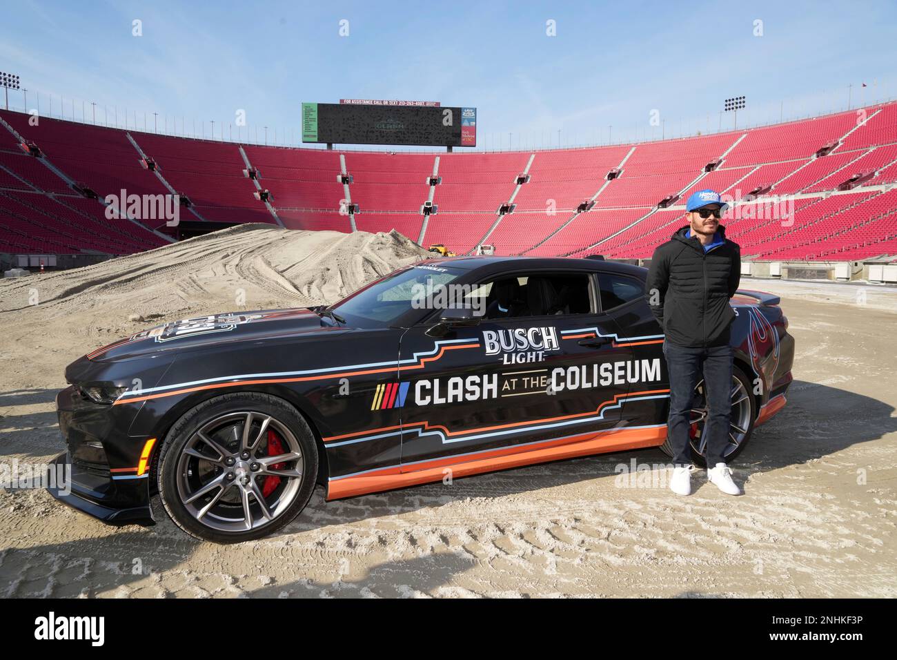 Kyle Larson poses with Chevrolet pace car during 2023 Busch Light Clash ...