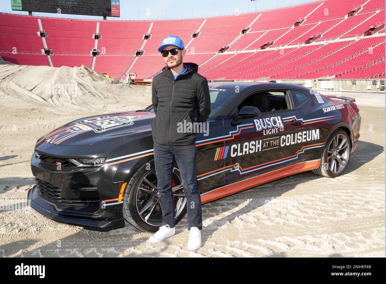 Kyle Larson poses with Chevrolet pace car during 2023 Busch Light Clash ...