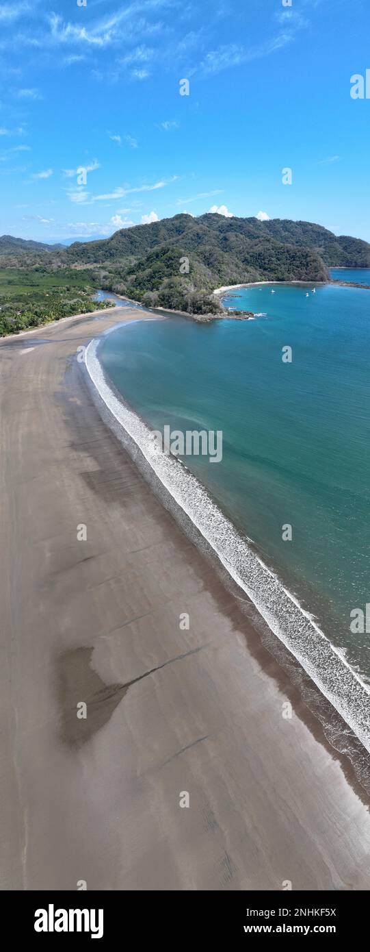 Lush Tropical coastline with rocks and blue water in Costa Rica near ...