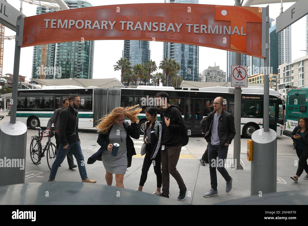 Passengers pass by The Temporary Transbay Terminal which is going to ...