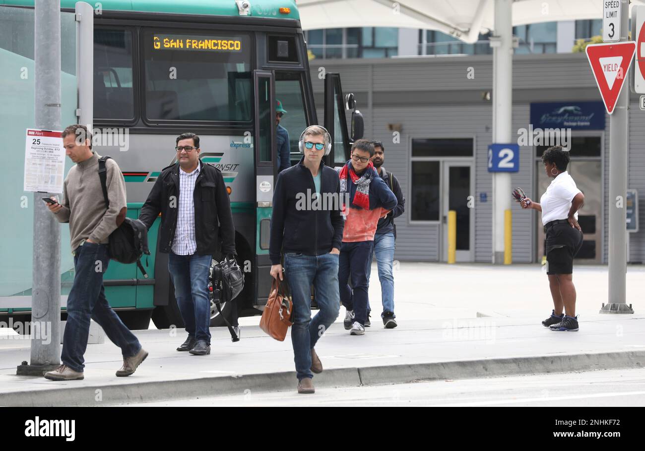 Passengers pass by The Temporary Transbay Terminal which is going to ...