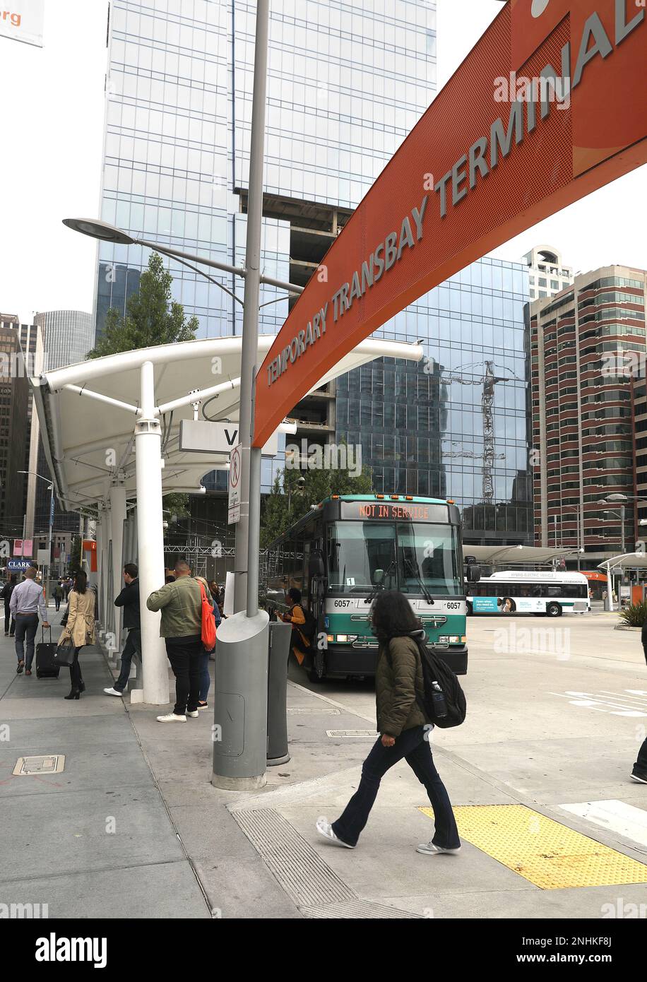 Passengers pass by The Temporary Transbay Terminal which is going to ...